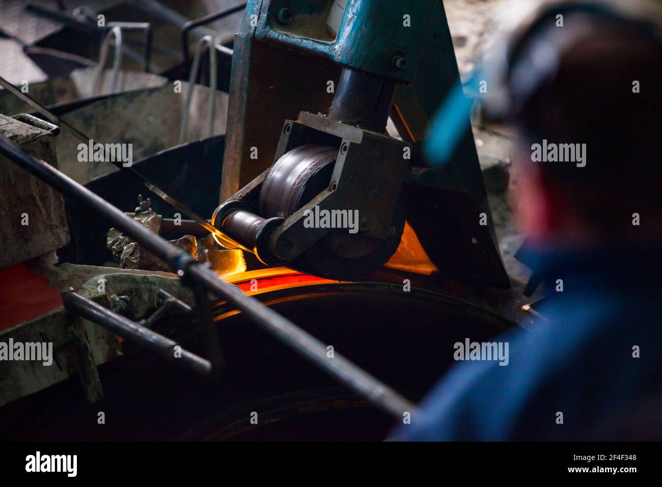Melted liquid aluminium in bath. Closeup of aluminium wire rod ...