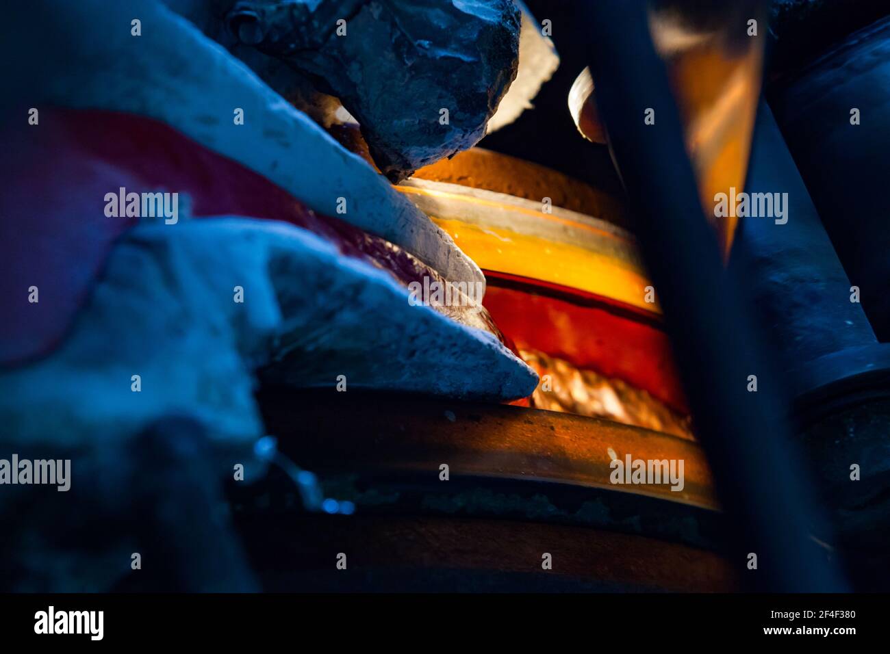 Closeup of aluminium wire rod production machine. Melted liquid ...