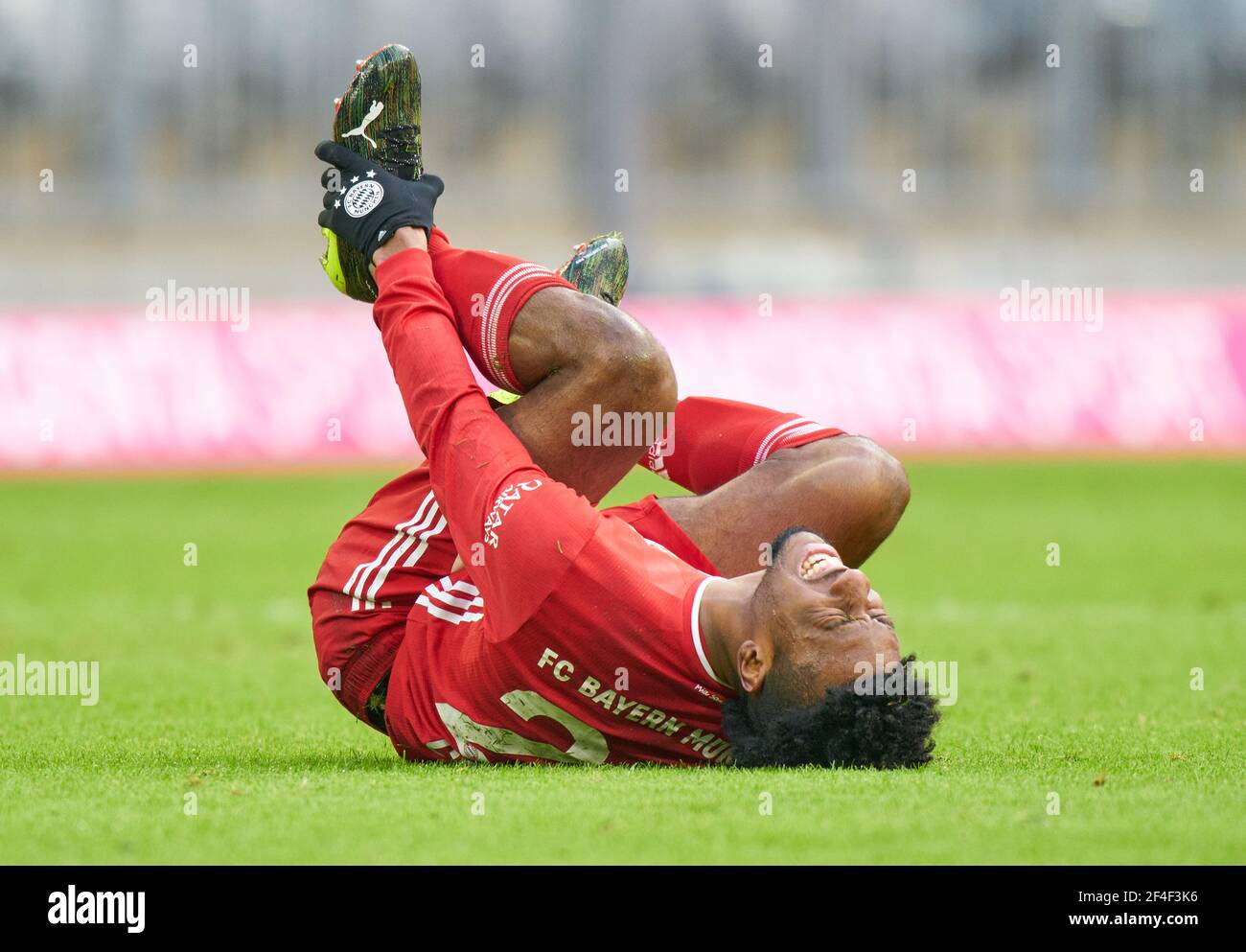 Munich, Germany. 20th Mar, 2021. Kingsley COMAN, FCB 29 pain, injury in ...