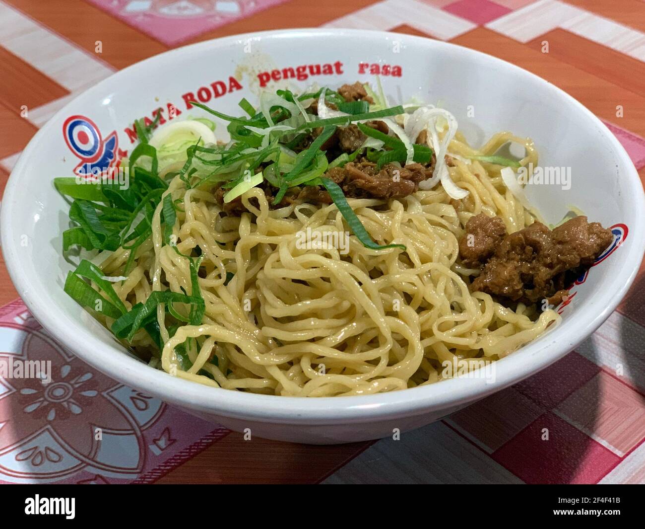 Mi or mie ayam, the popular Chinese Indonesian dish Stock Photo - Alamy