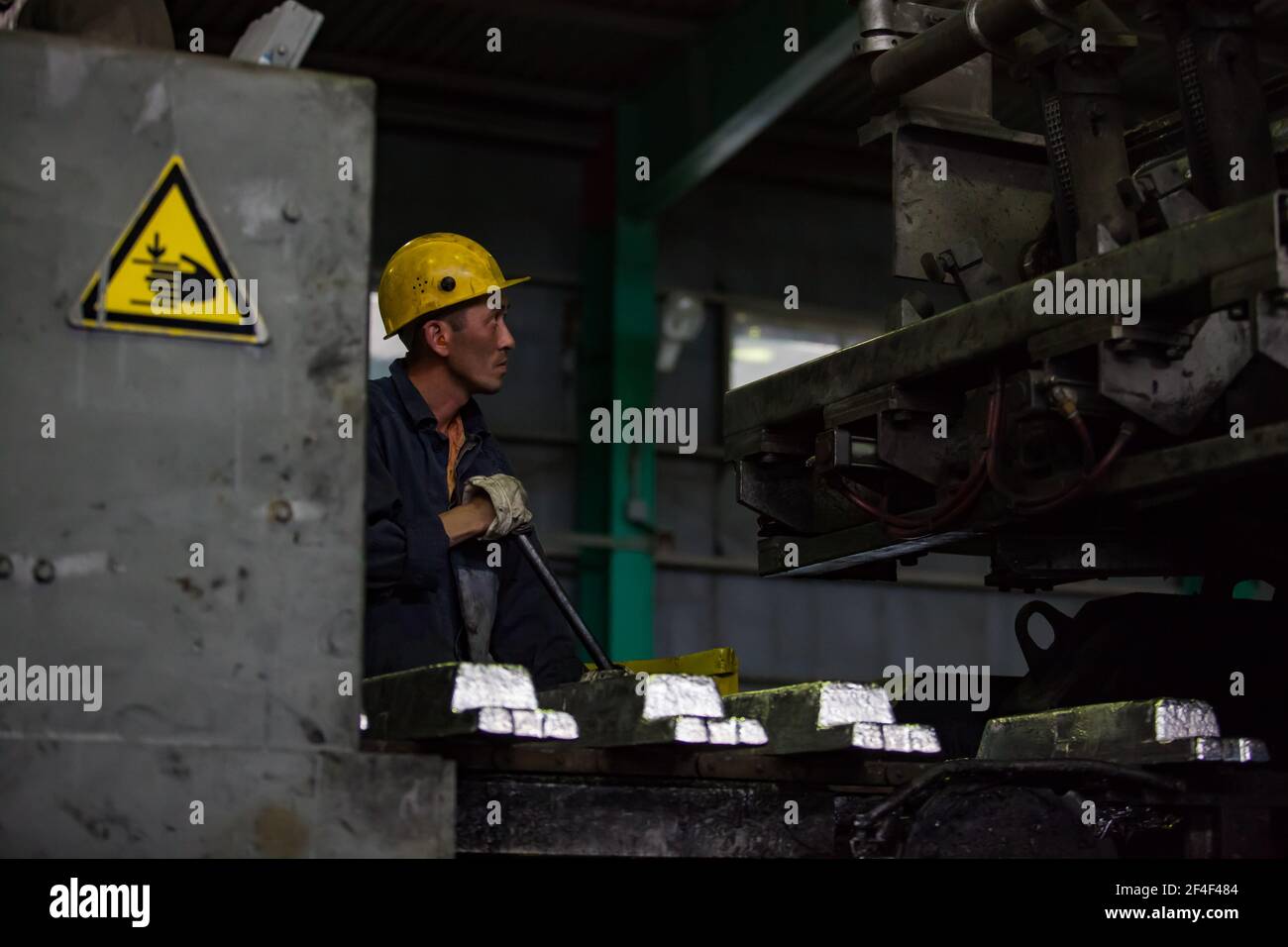 Asian machine operator in production hi-res stock photography and ...