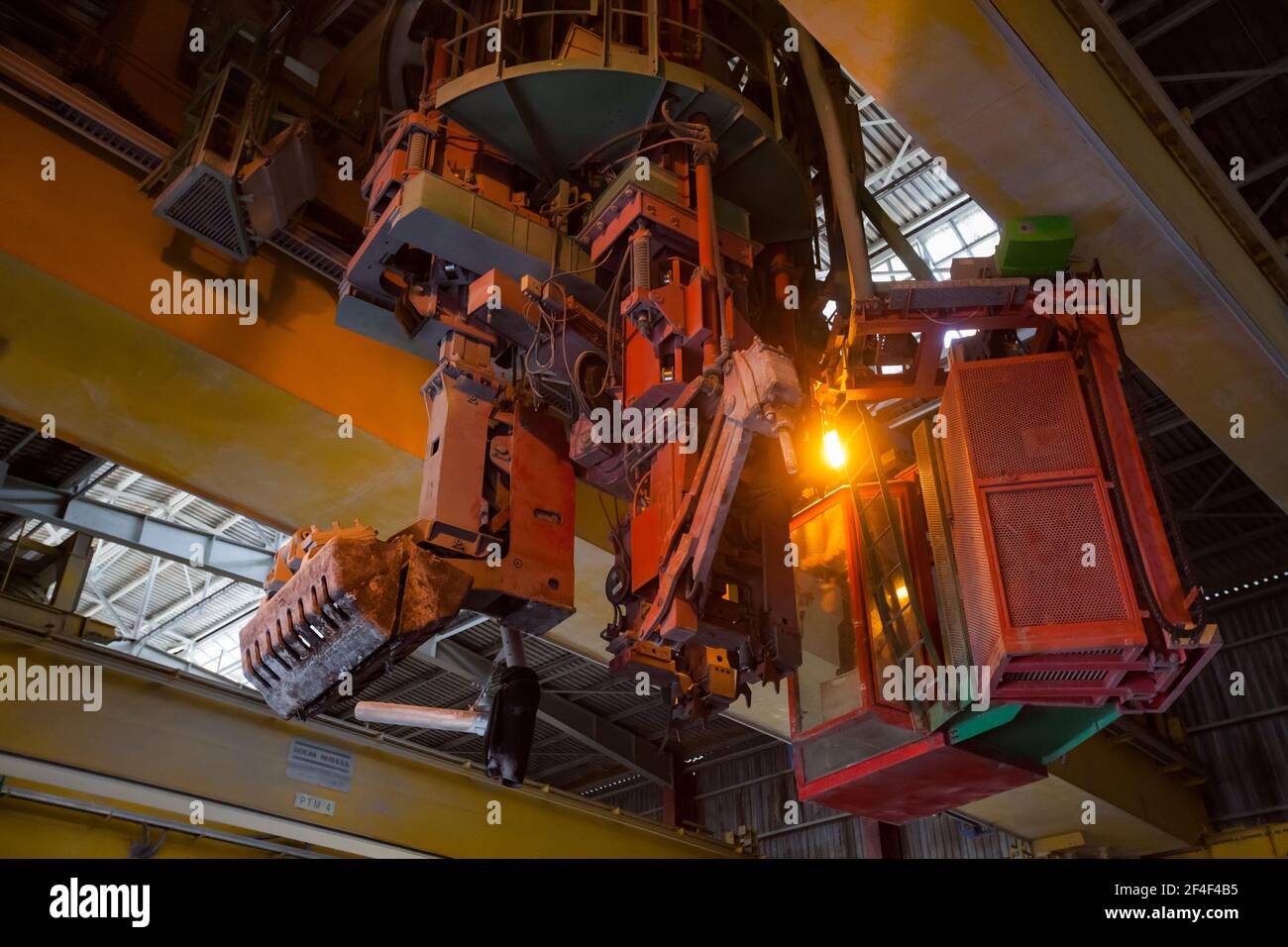 Aluminum electrolysis plant. Slag handling crane machine close-up. Slag ...
