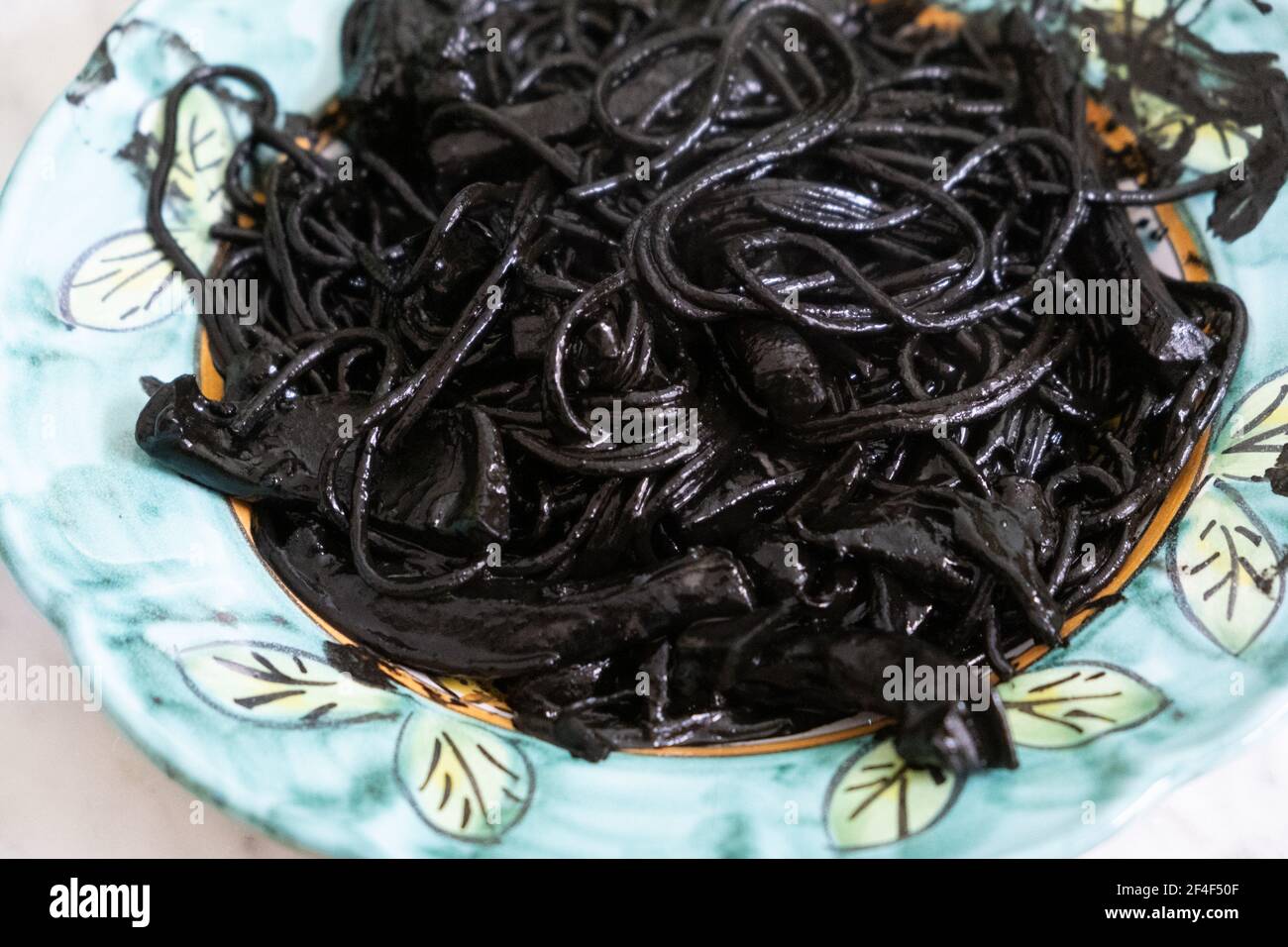 Spaghetti with cuttlefish ink, a traditional Neapolitan dish Stock ...