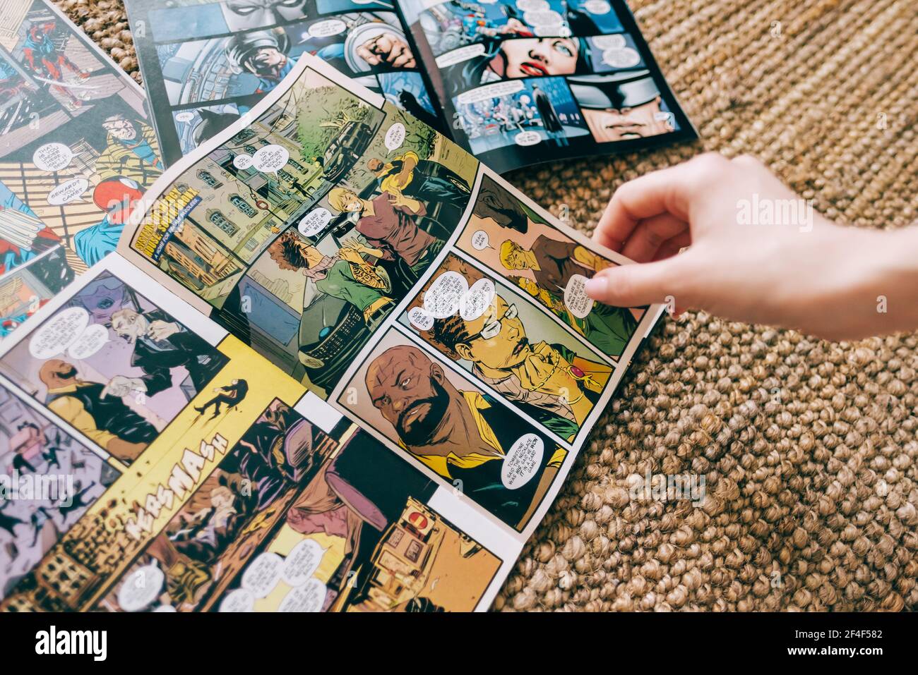Reading batman comic hi-res stock photography and images - Alamy