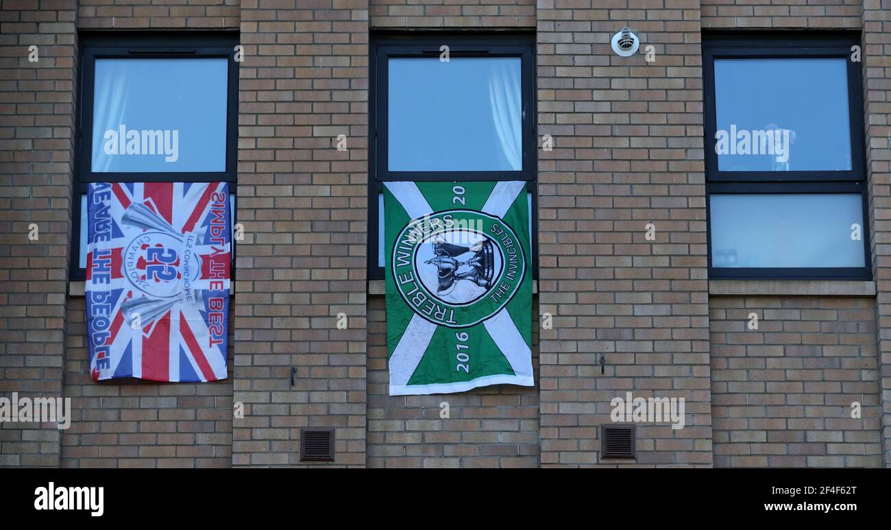 Flags hang from windows of flats on Springfield Road near Celtic Park ...