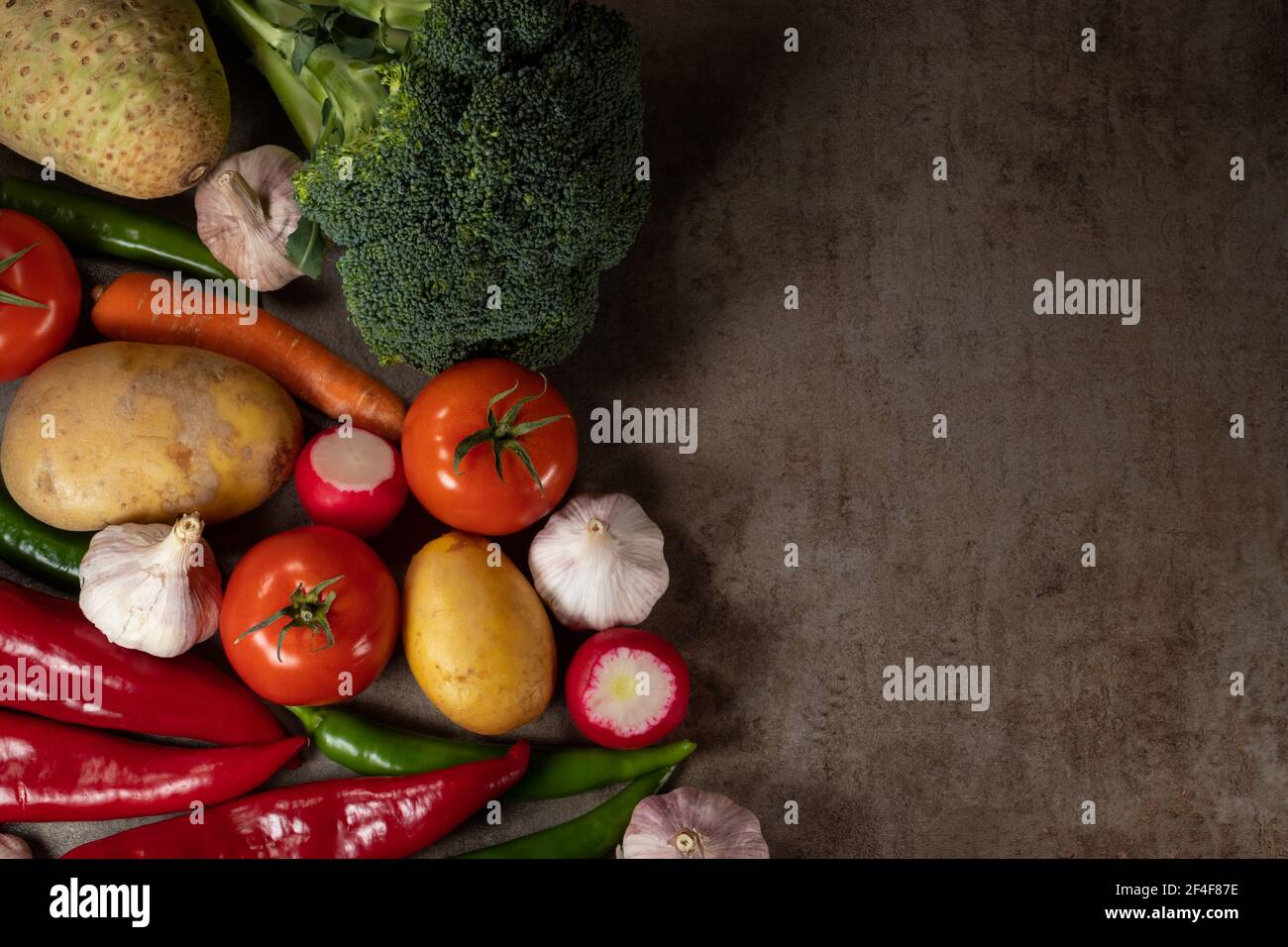 Different vegetables on an earthy background Stock Photo - Alamy