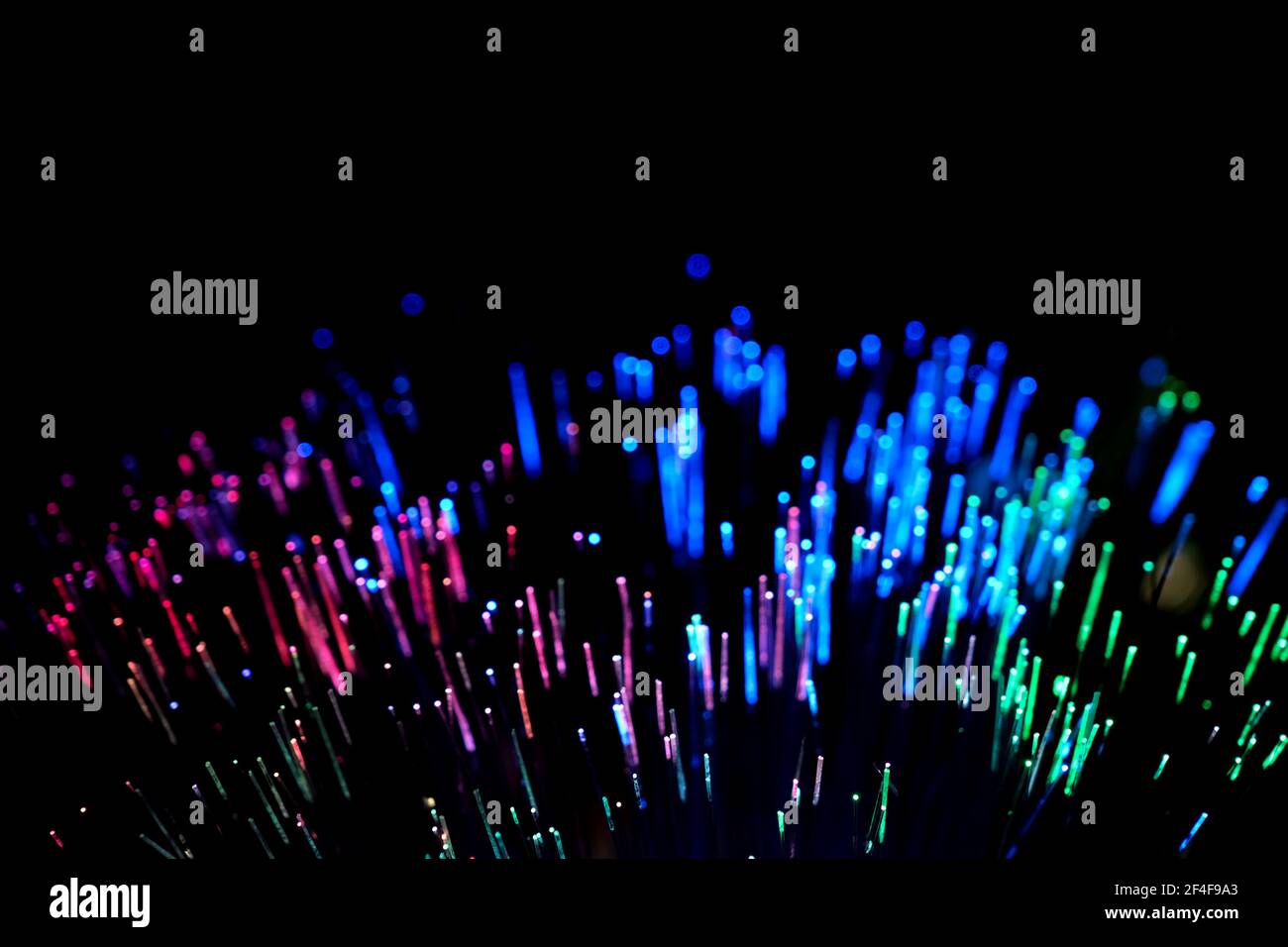Optical fiber network cable on black background Stock Photo - Alamy