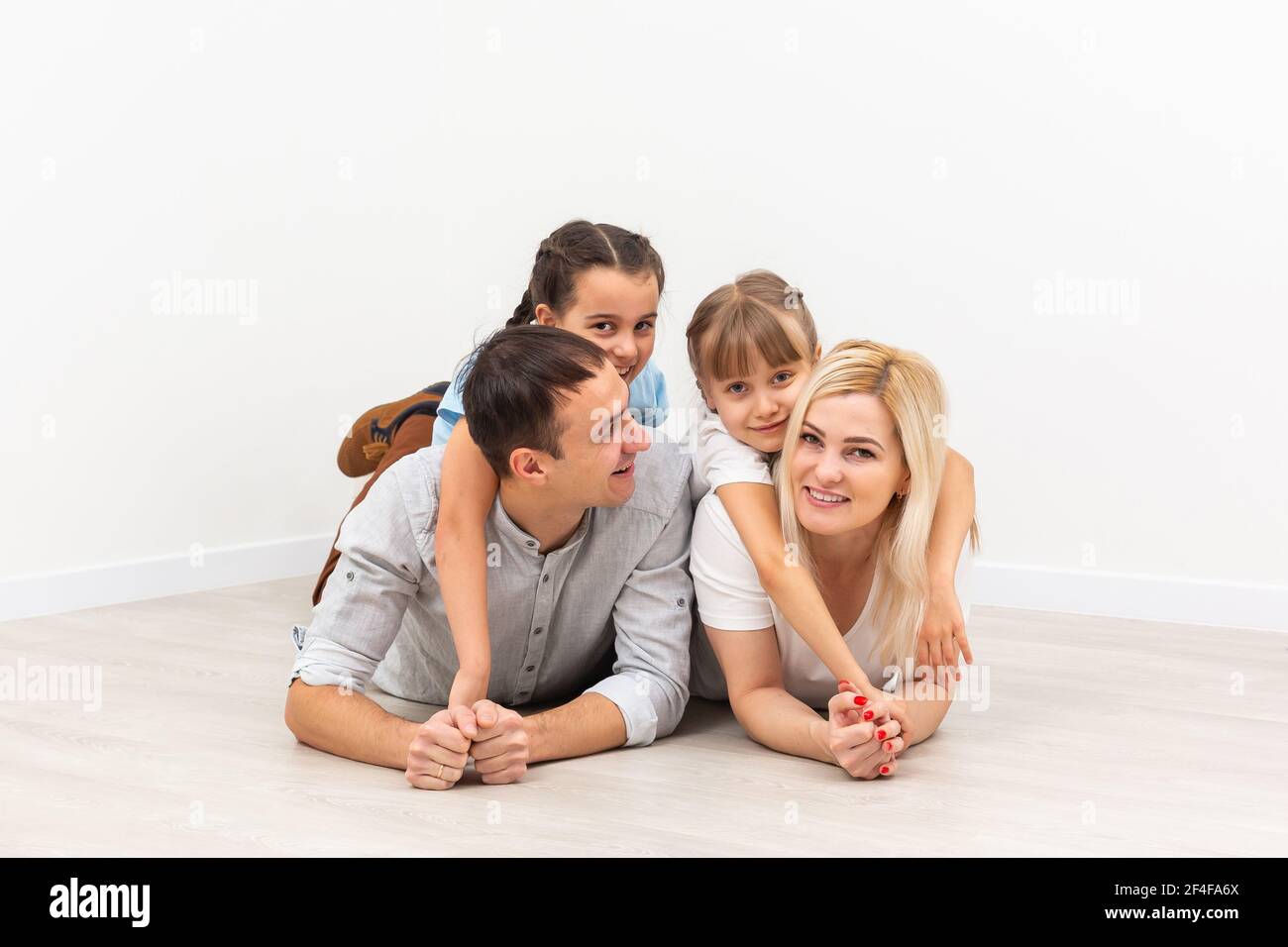 Smiling young parents and their children are very happy, they are at ...