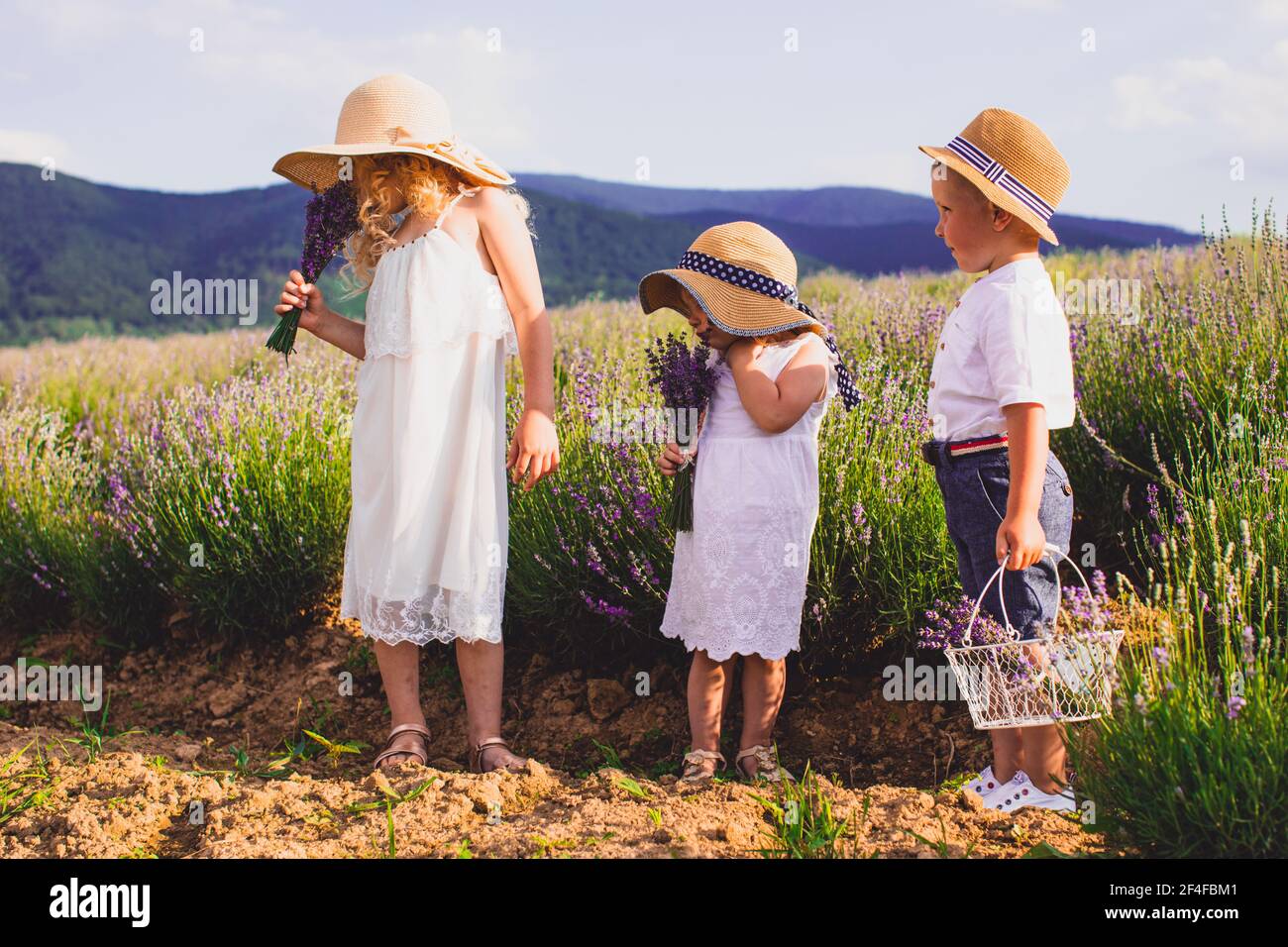 Three adorable kids, brother and two sisters Stock Photo - Alamy