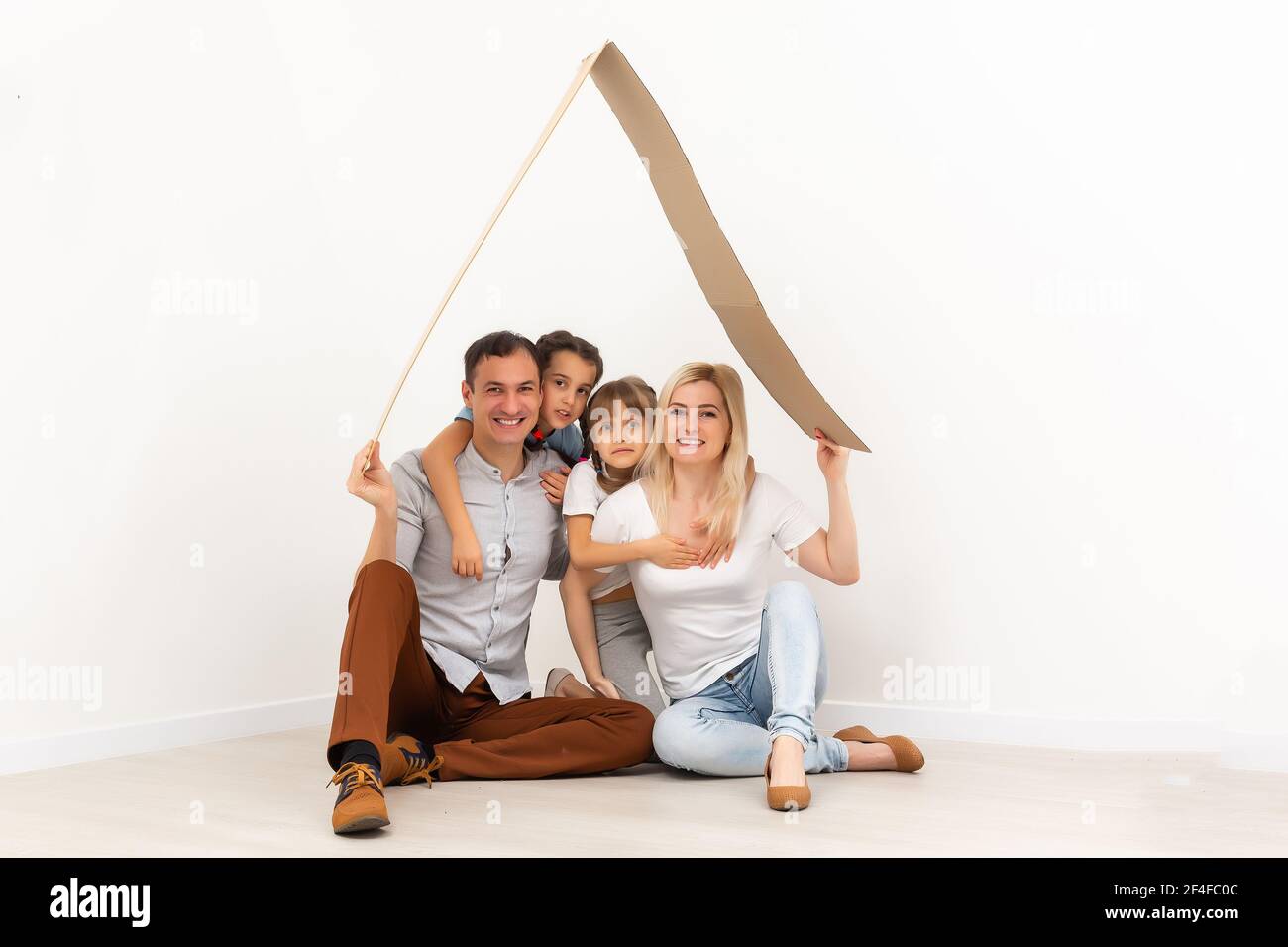 concept housing a young family. mother father and children in a new ...