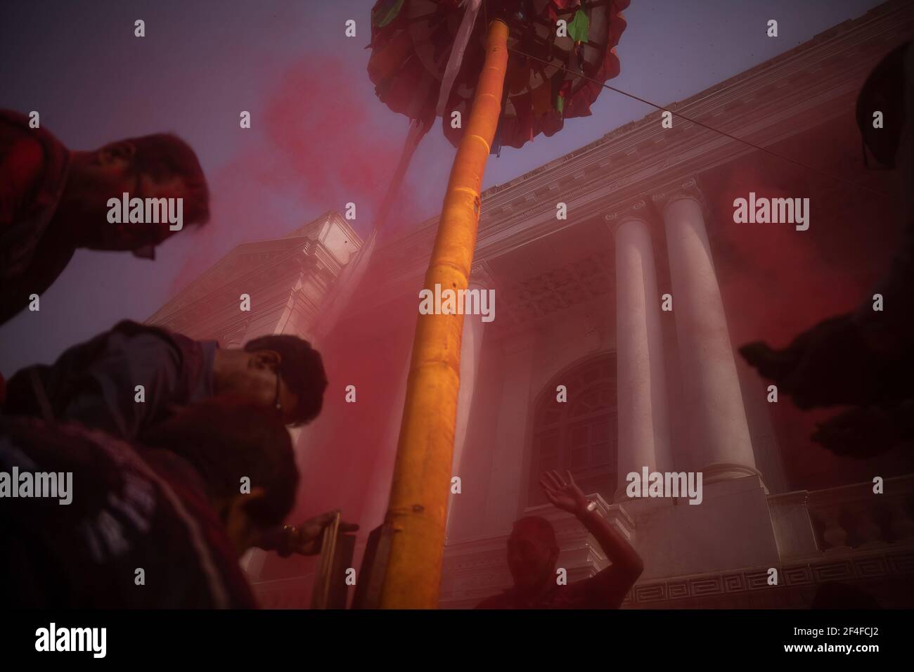 Kathmandu, Nepal. 21st Mar, 2021. Peoples throw vermilion powder after ...