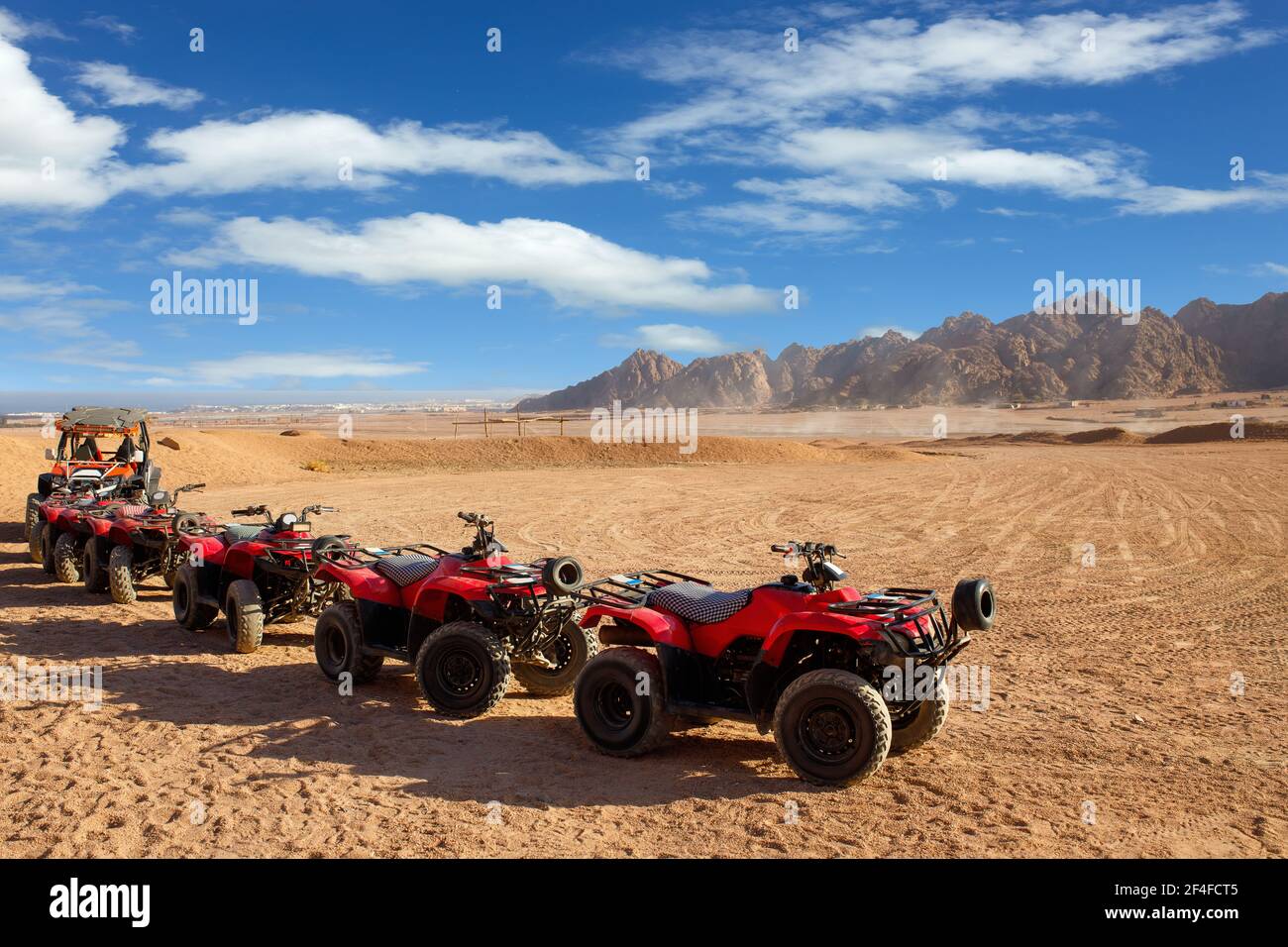 red all-terrain vehicles in off-road egyptian desert Stock Photo - Alamy