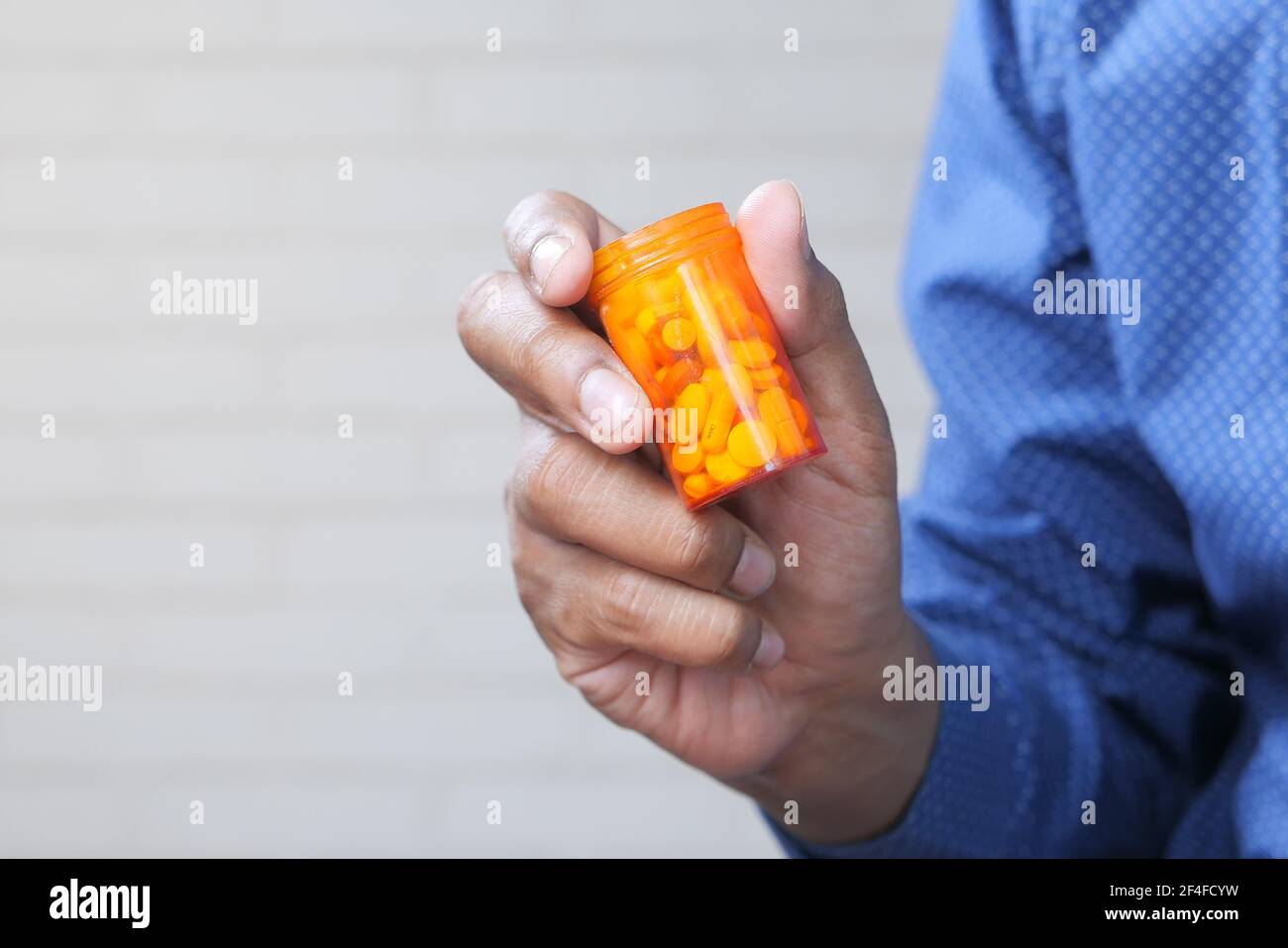 Person hand holding pill container hi-res stock photography and images ...