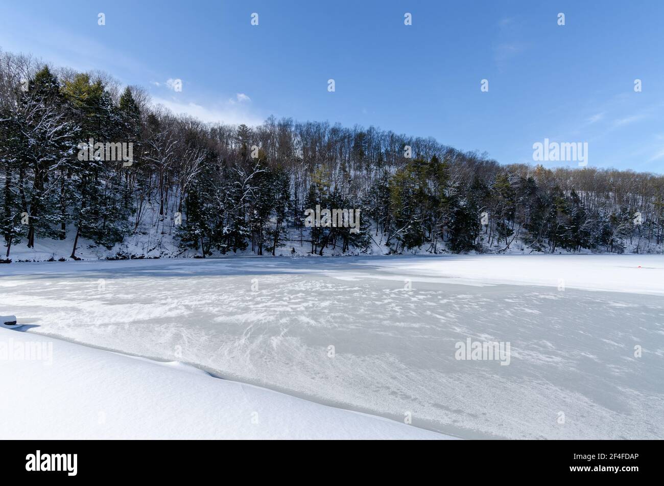 Frozen over lake at a state park after a blizzard Stock Photo - Alamy