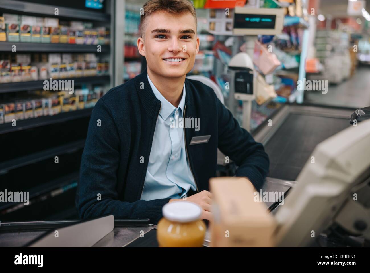 Man sitting behind the counter hi-res stock photography and images - Alamy