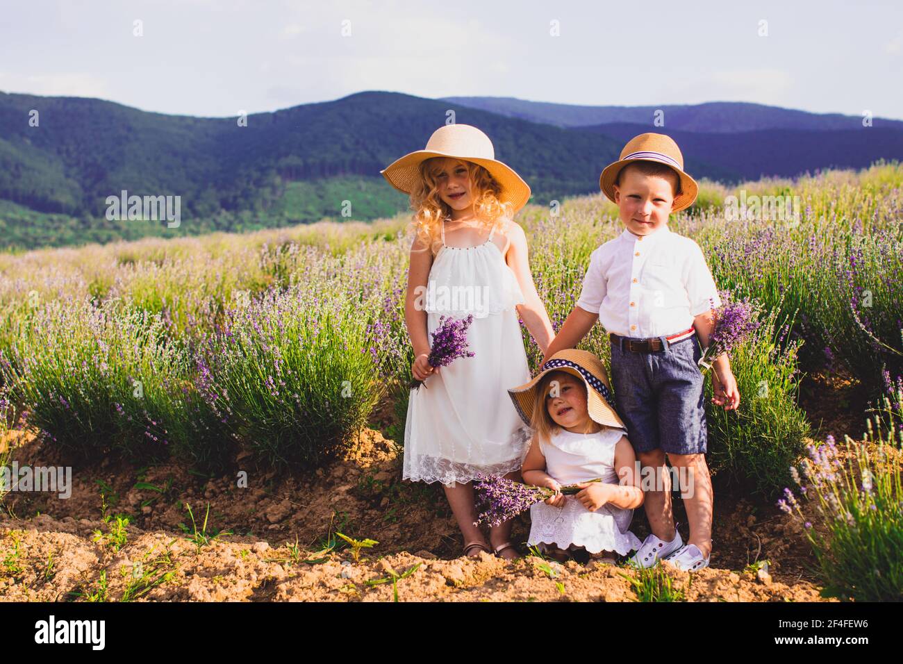 Three adorable kids, brother and two sisters Stock Photo - Alamy