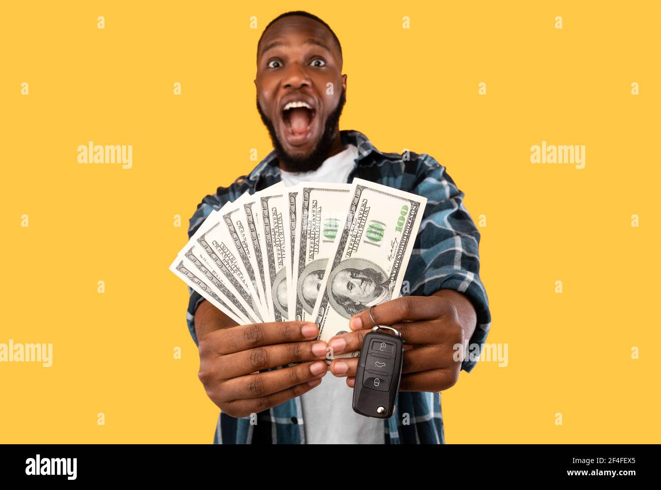 Excited African American Guy Showing Money Posing Over Yellow ...