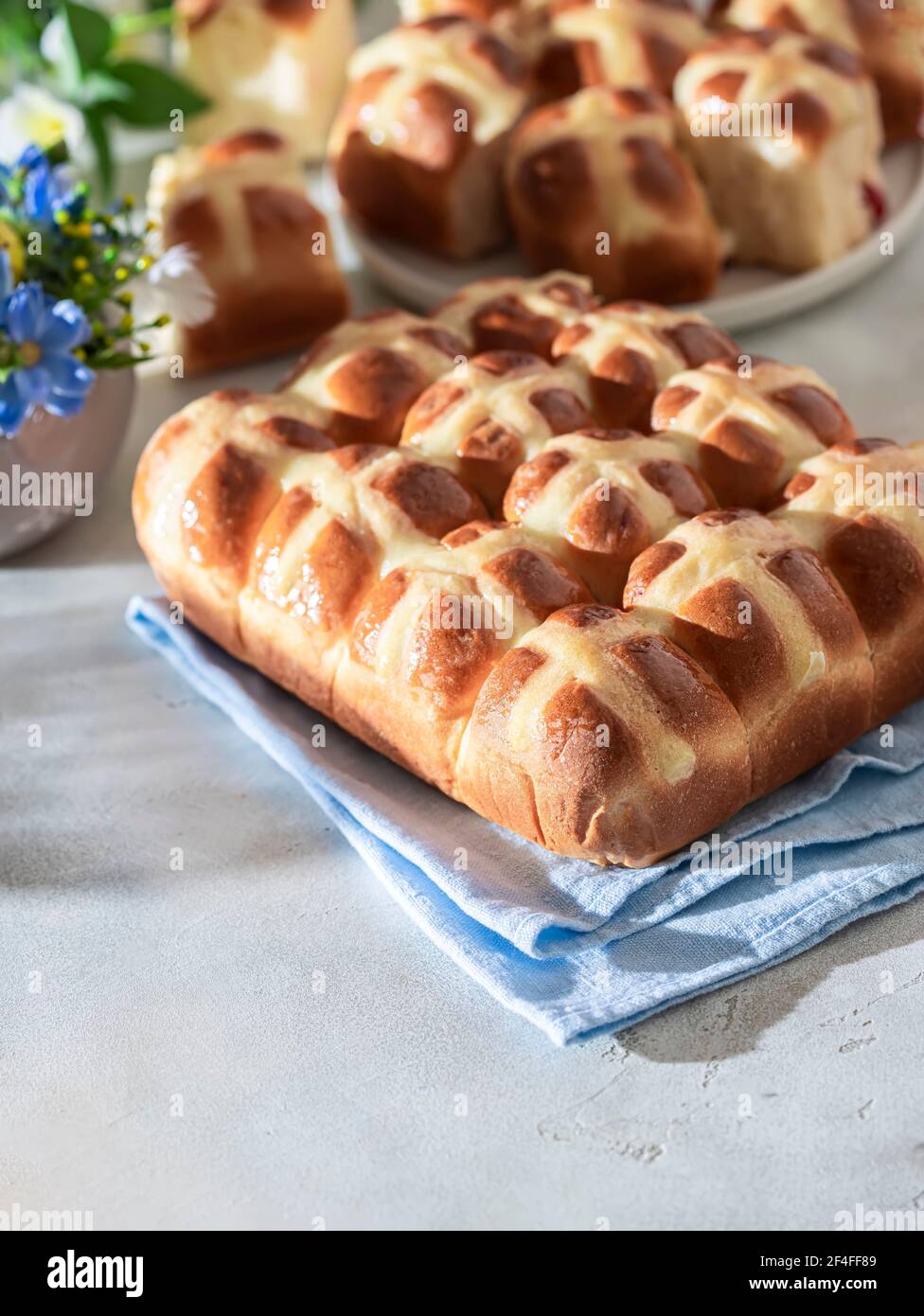 Homemade Hot Cross Buns on a light concrete background. Traditional ...