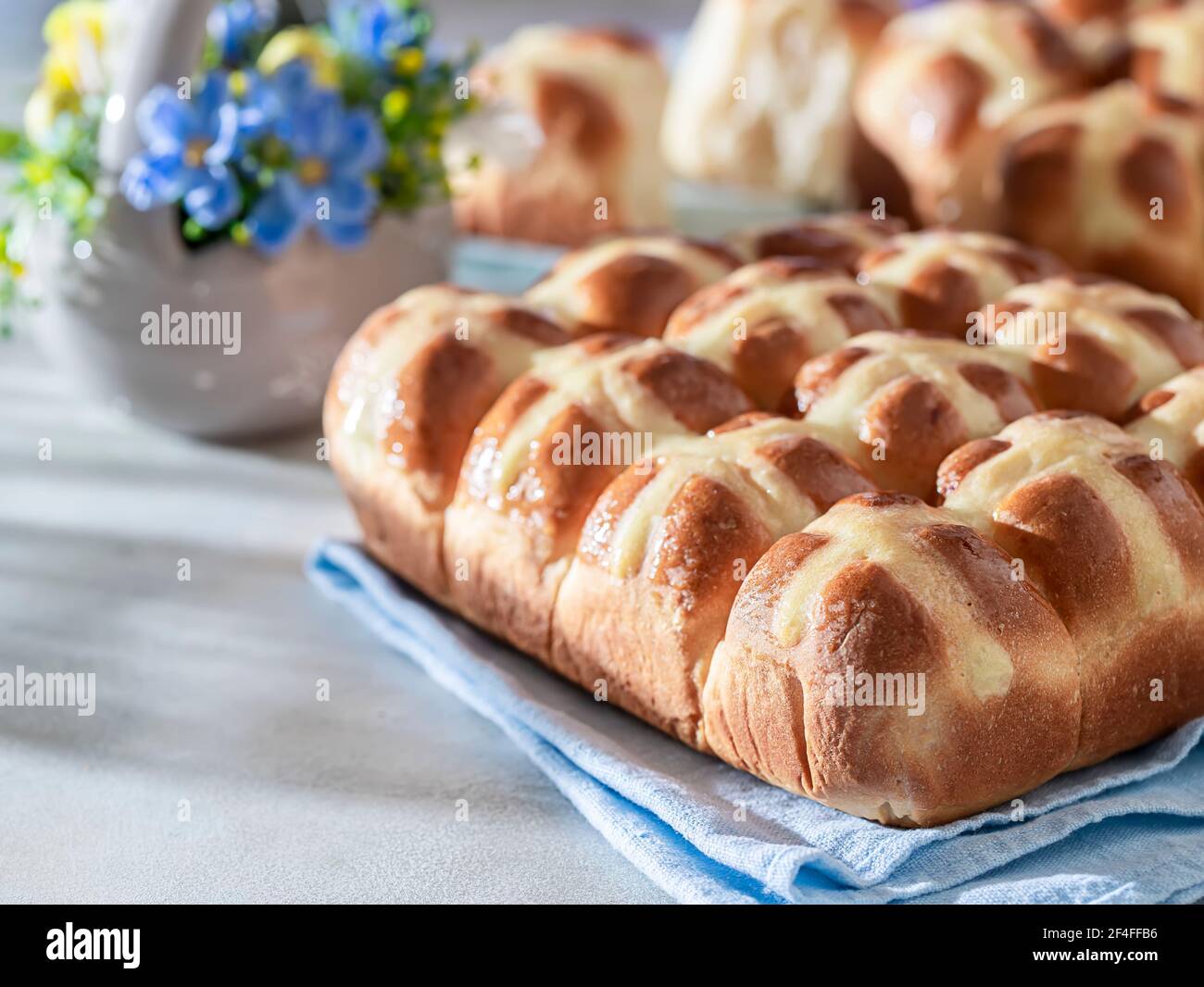 Homemade Hot Cross Buns on a light concrete background. Traditional ...