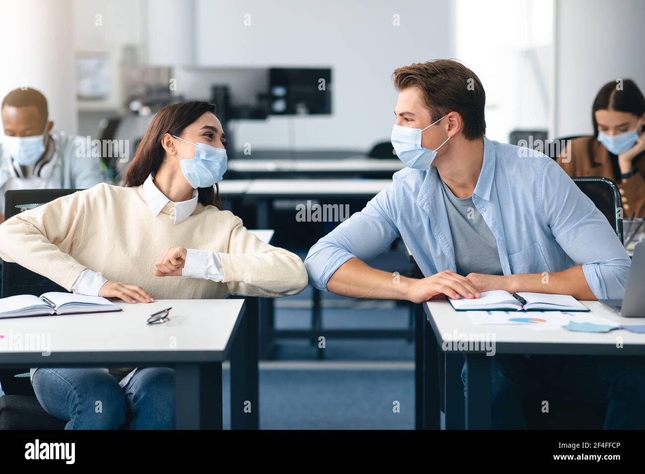 Student bumping elbows hi-res stock photography and images - Alamy
