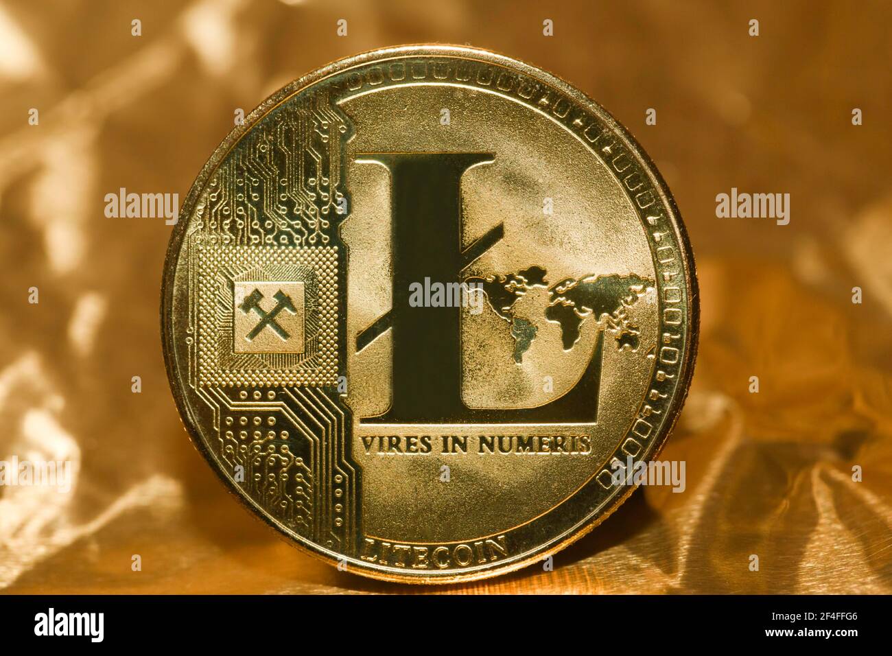 Litecoin, golden background Stock Photo - Alamy