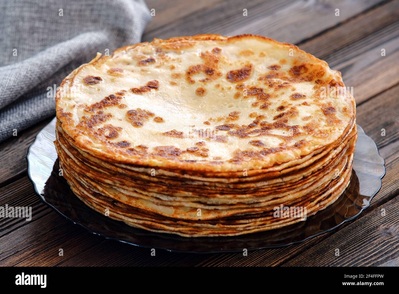 A tall stack of pancakes. Breakfast for the whole family. Maslenitsa ...
