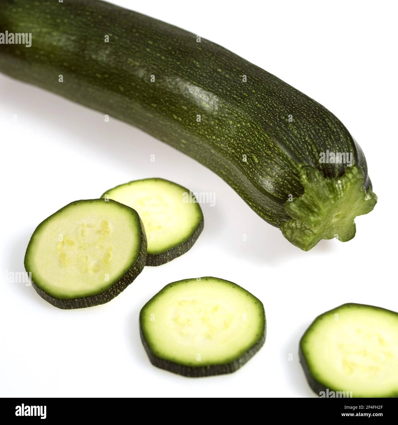 Long zucchini or courgettes, vegetables against white background Stock ...