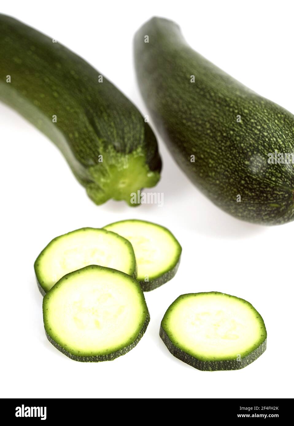 LONG ZUCCHINI OR ZUCCHINI ON WHITE BACKGROUND Stock Photo - Alamy