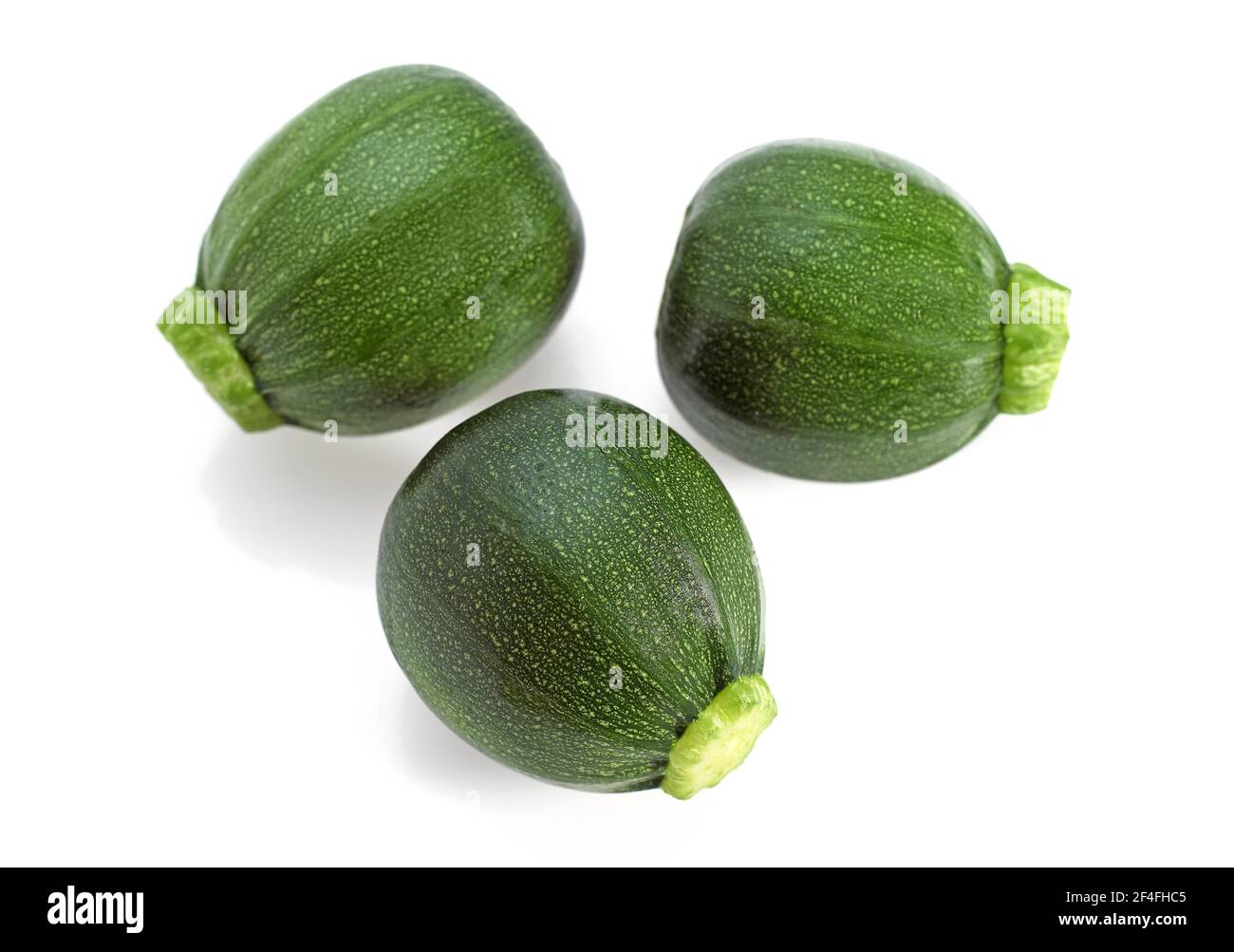 Round zucchini or courgettes, vegetables against white background Stock ...