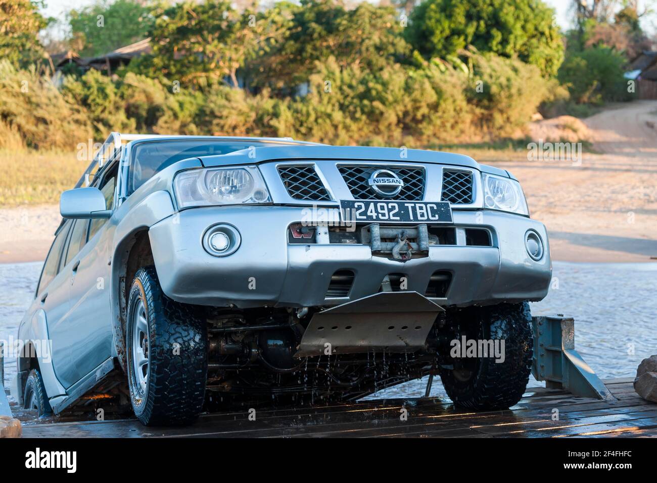 Off-road vehicle rides on ferry across the Manambolo, Bekopaka ...