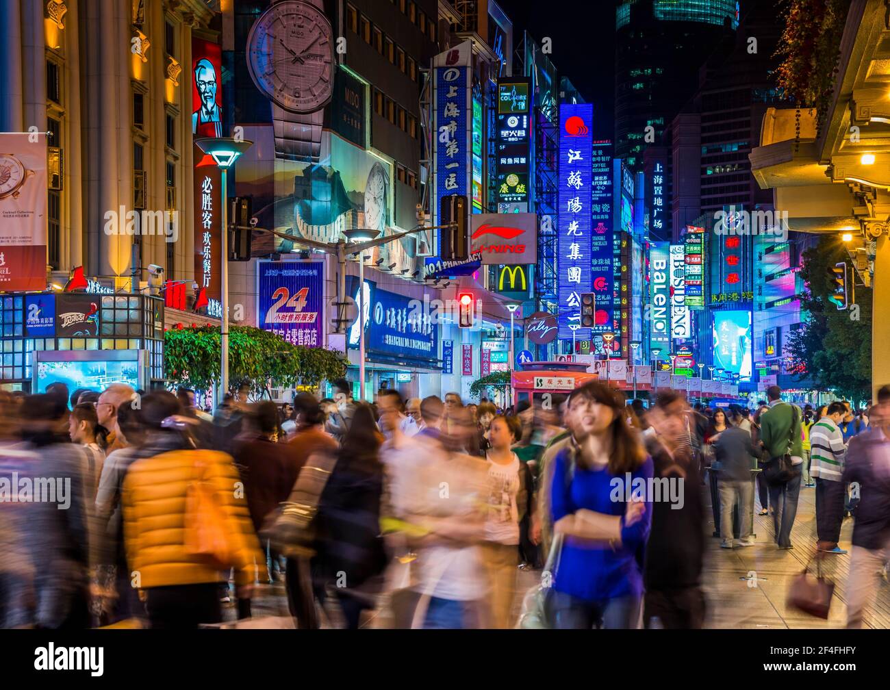 Nanjing Road, pedestrian zone and busy shopping street at night ...