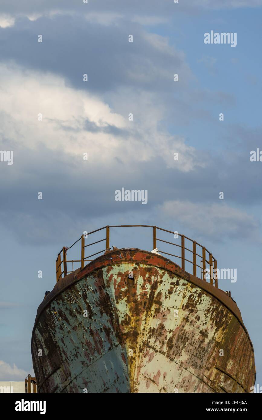 rusty bow and hull of an old trawler on a quay in Antwerp, Belgium ...