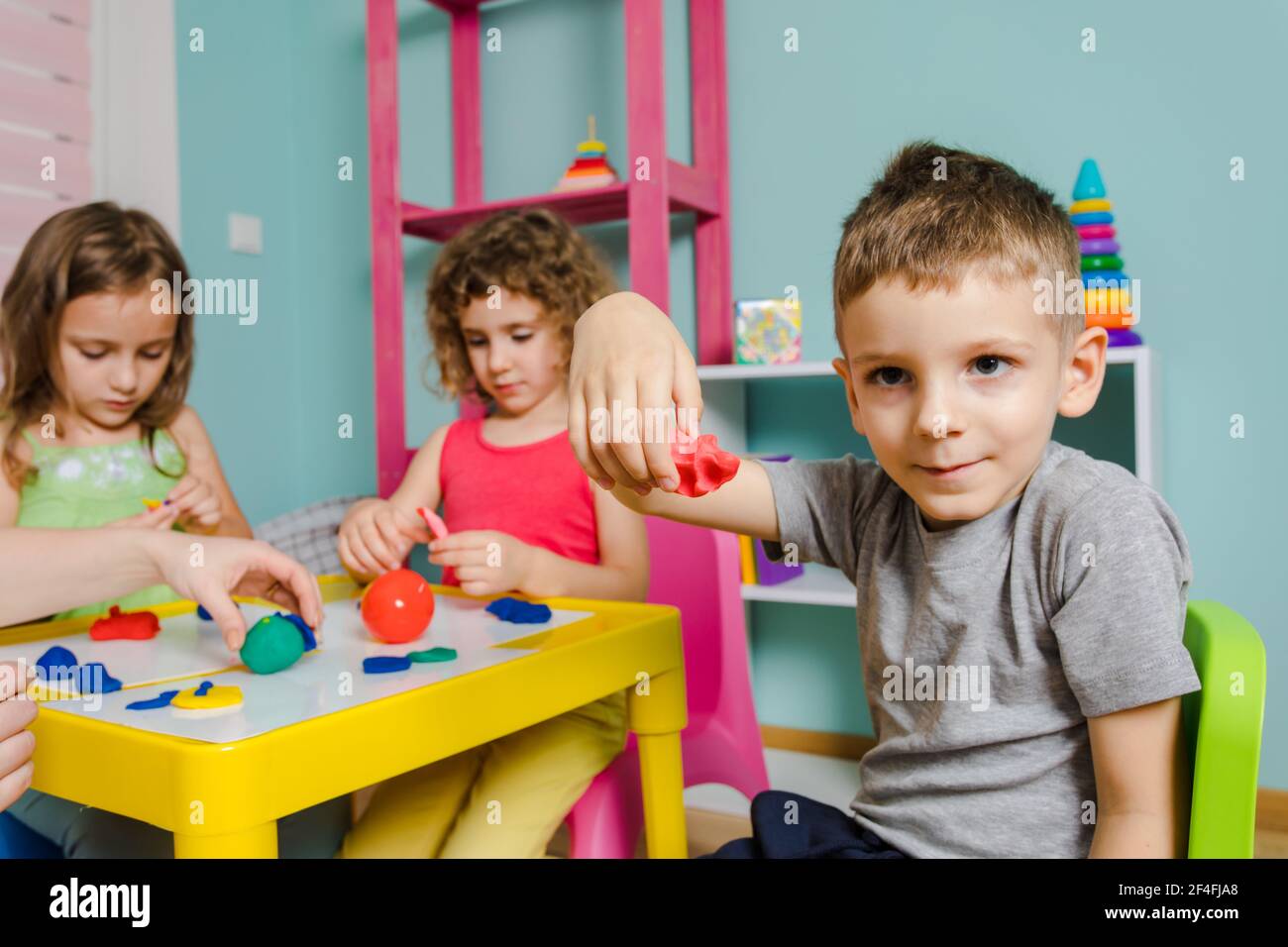 the child enjoys his work at the kindergarten Stock Photo - Alamy