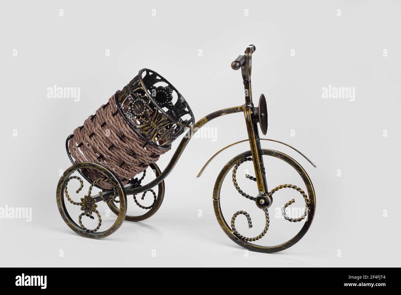 Wine holder tricycle on a white background Stock Photo - Alamy