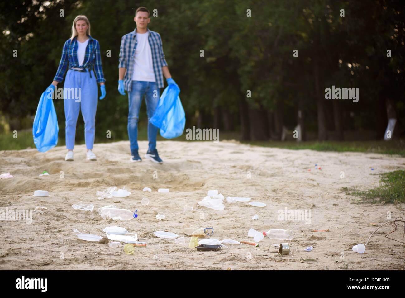Diverse Group of People Picking Up Trash in The Park Volunteer ...