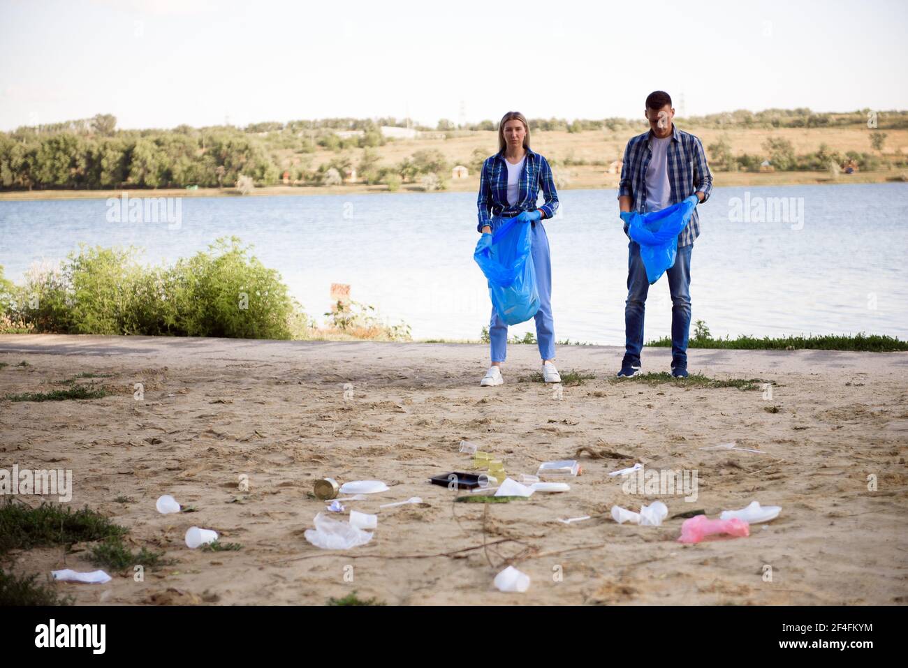 Diverse Group of People Picking Up Trash in The Park Volunteer ...