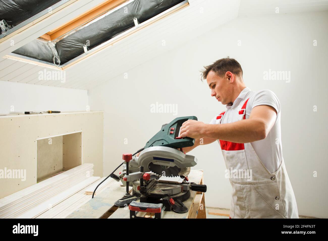 the master works with a special tool is processing boards Stock Photo ...