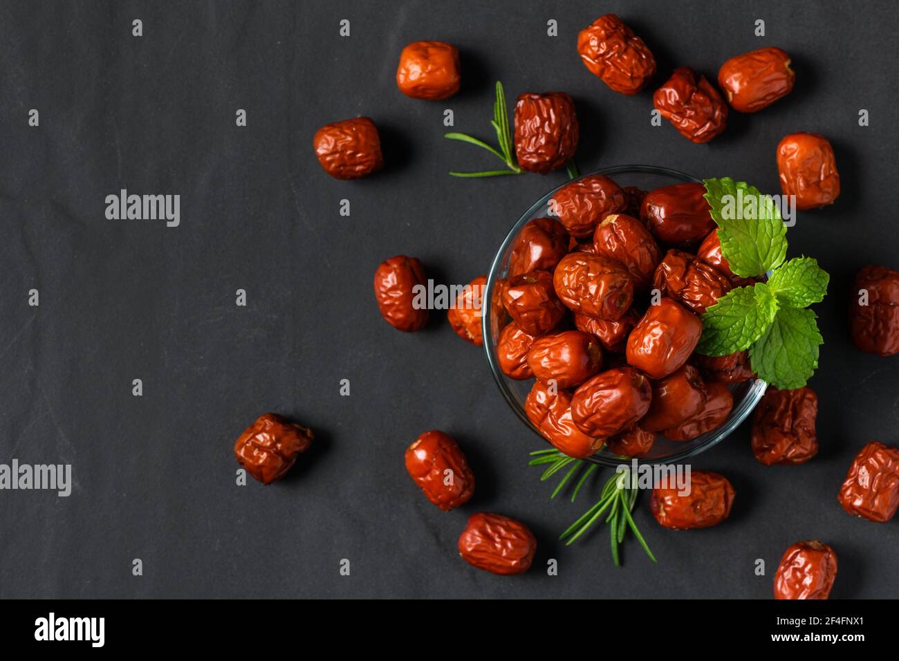 Dried Jujube, Chinese dried red date fruit with Mint leaves in glass ...