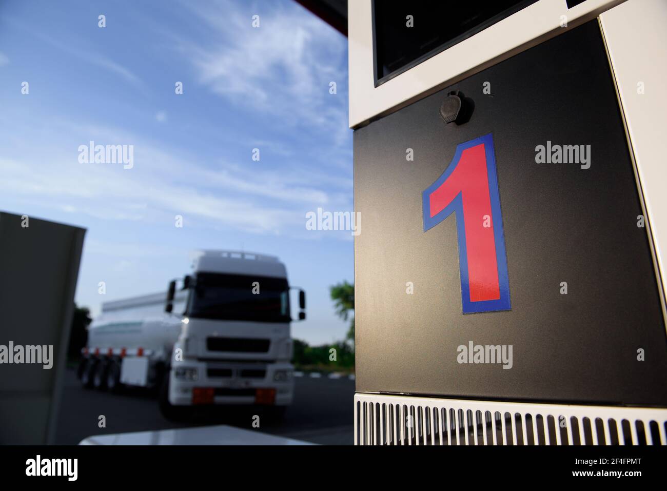 Large metal fuel tank truck transporting fuel at a gas station Stock ...