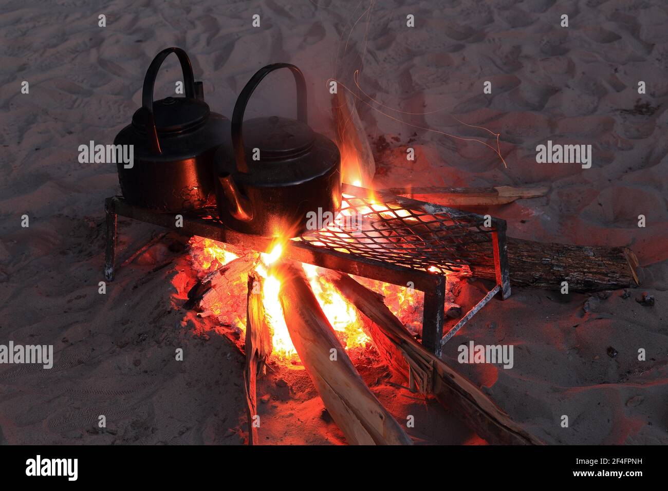 Water jug, fireplace, hotel, campfire, Okavango Delta, Botswana Stock ...