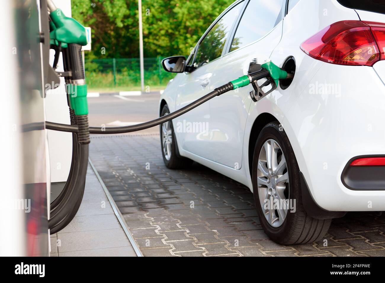 The driver pump the car's gasoline with fuel at the petrol station. Car ...