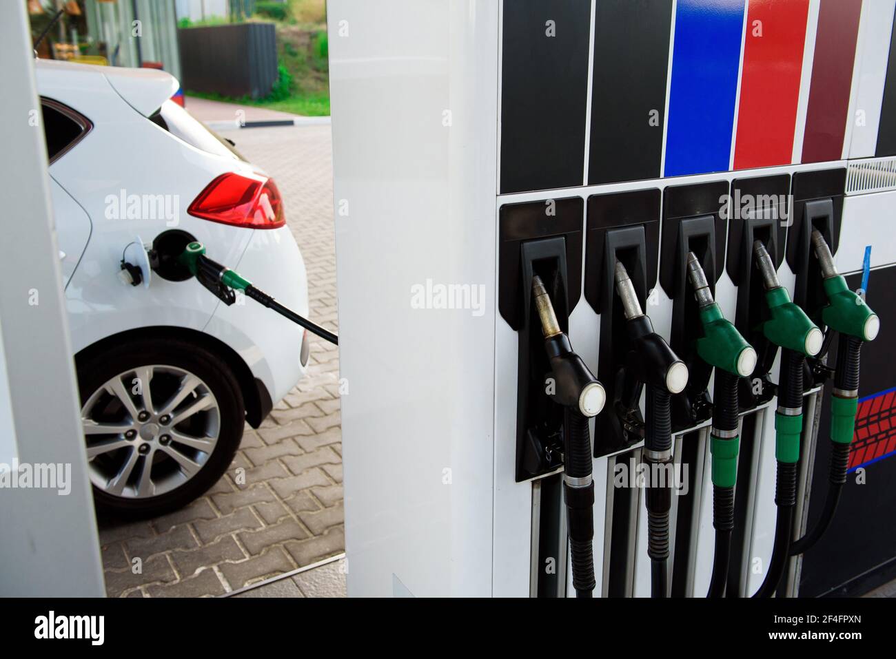 The driver pump the car's gasoline with fuel at the petrol station. Car ...