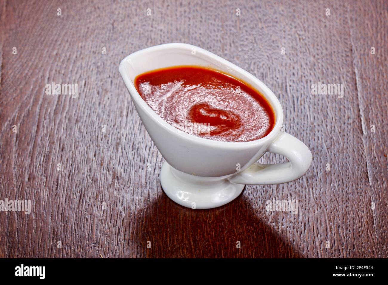 Tasty ketchup in the bowl for serving Stock Photo - Alamy