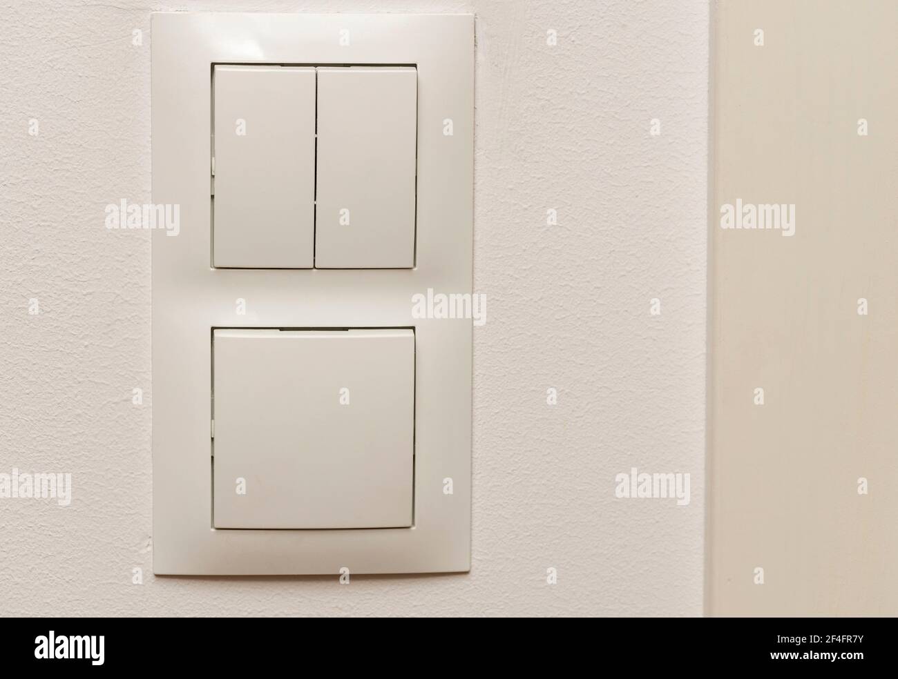 View of white light switch pair on wall . Building construction ...