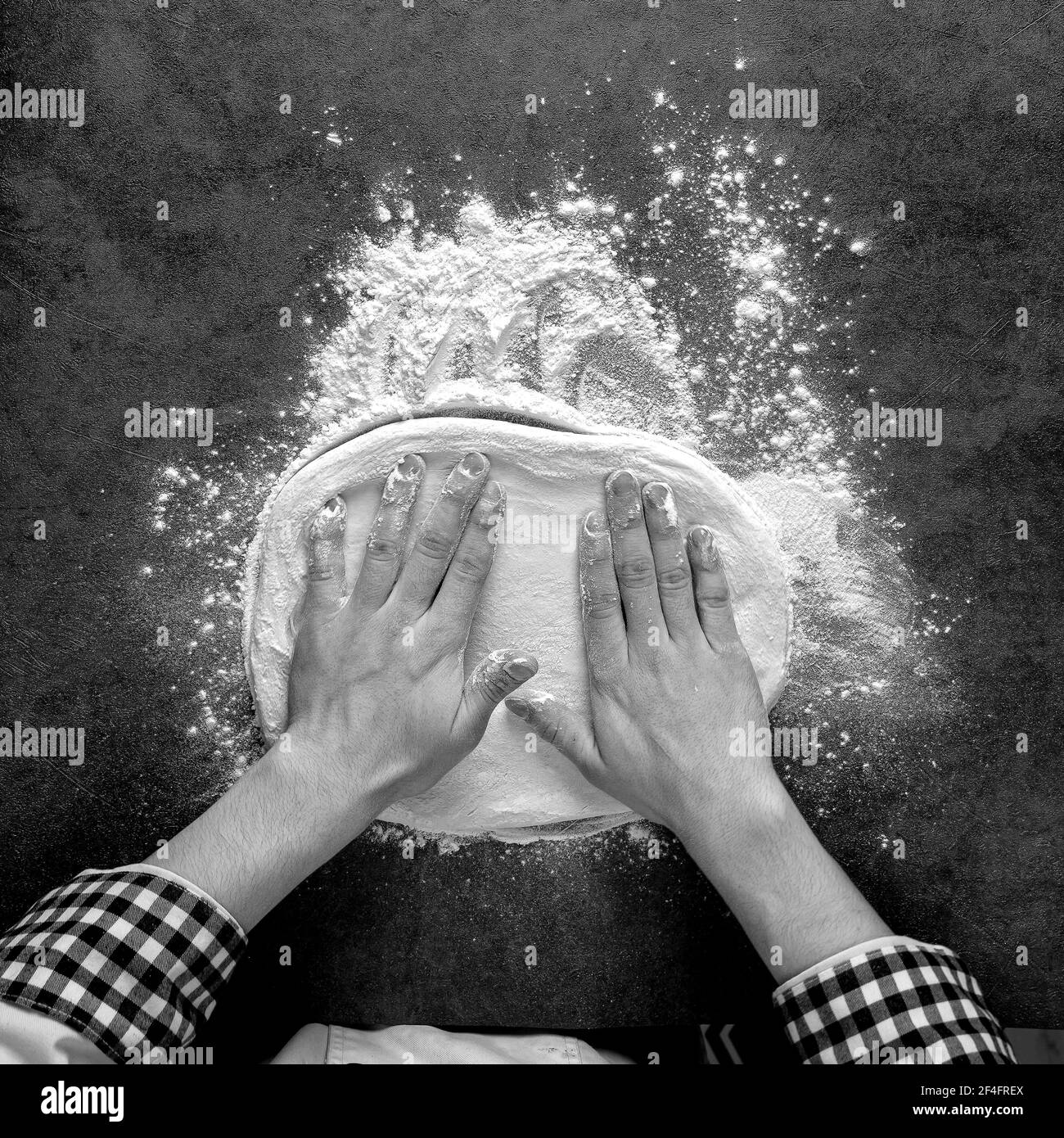 Hands making a pizza dough with flour Stock Photo - Alamy
