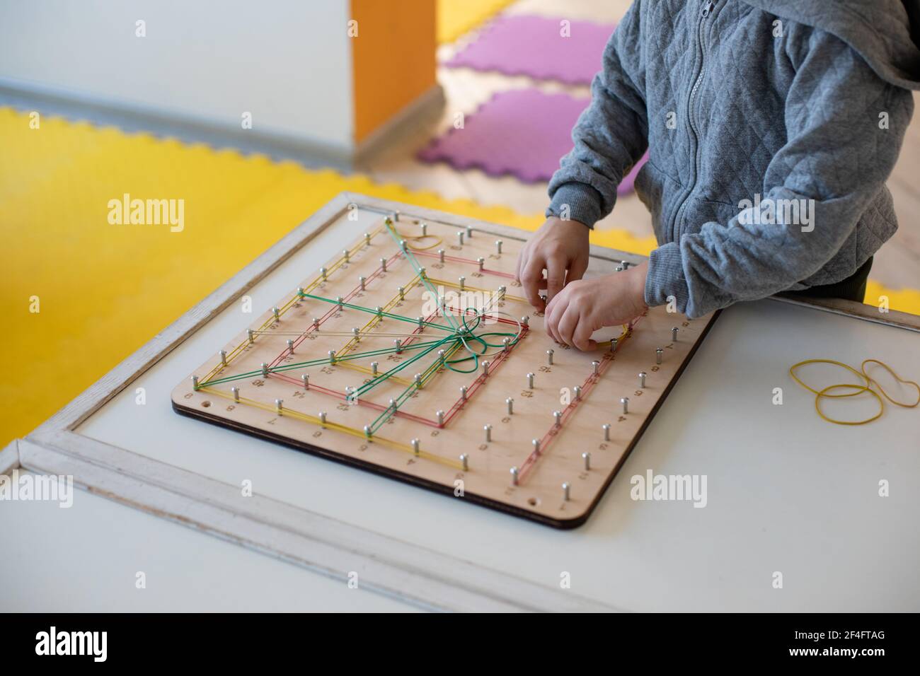 Exploring Basic Math And Geometry Concepts With Geoboard Stock Photo
