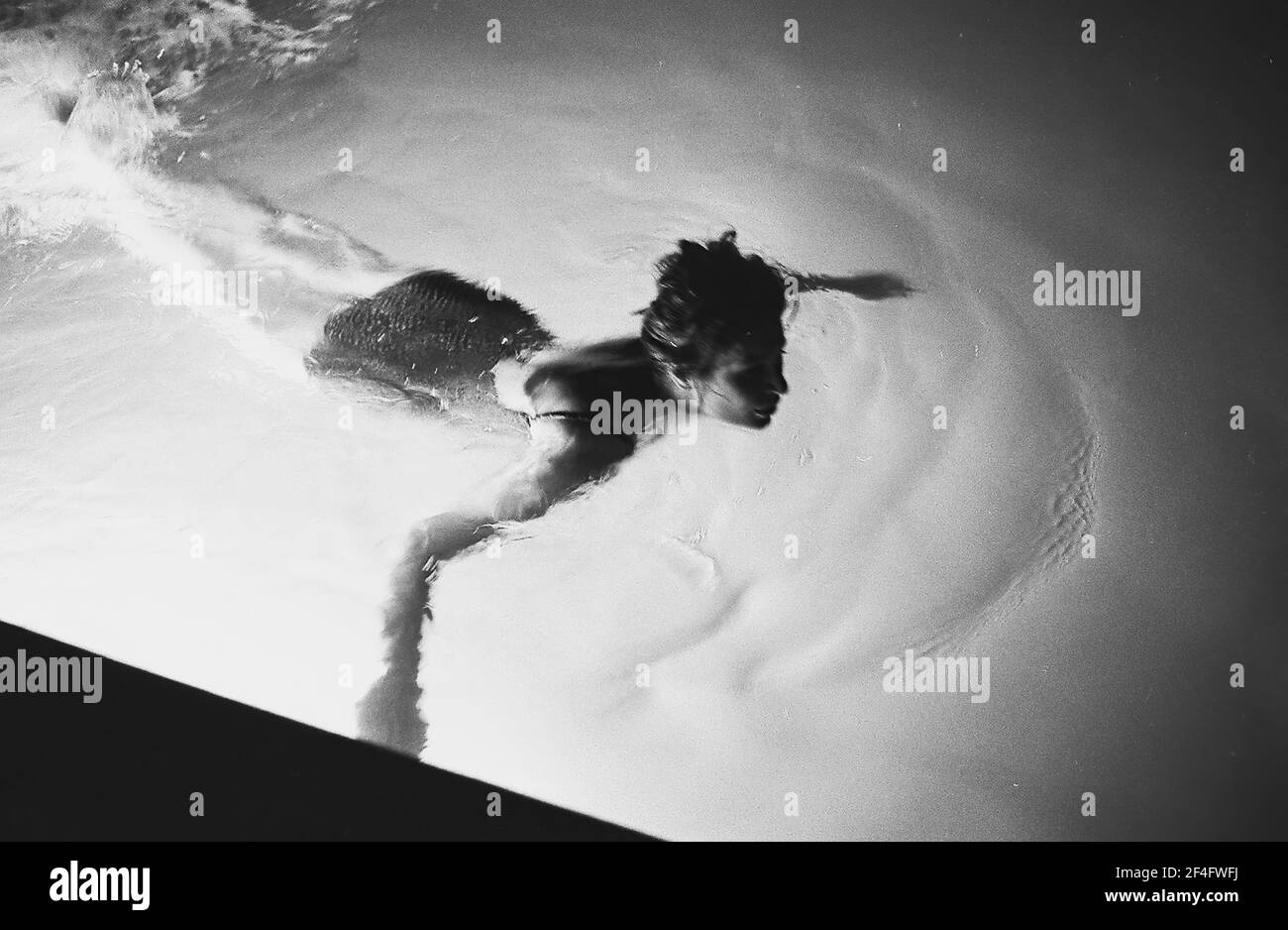 High angle view of woman in pool at resort, Pinar del Rio, Cuba ...
