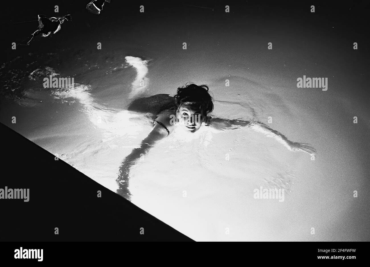 Black bathing suit hi-res stock photography and images - Alamy