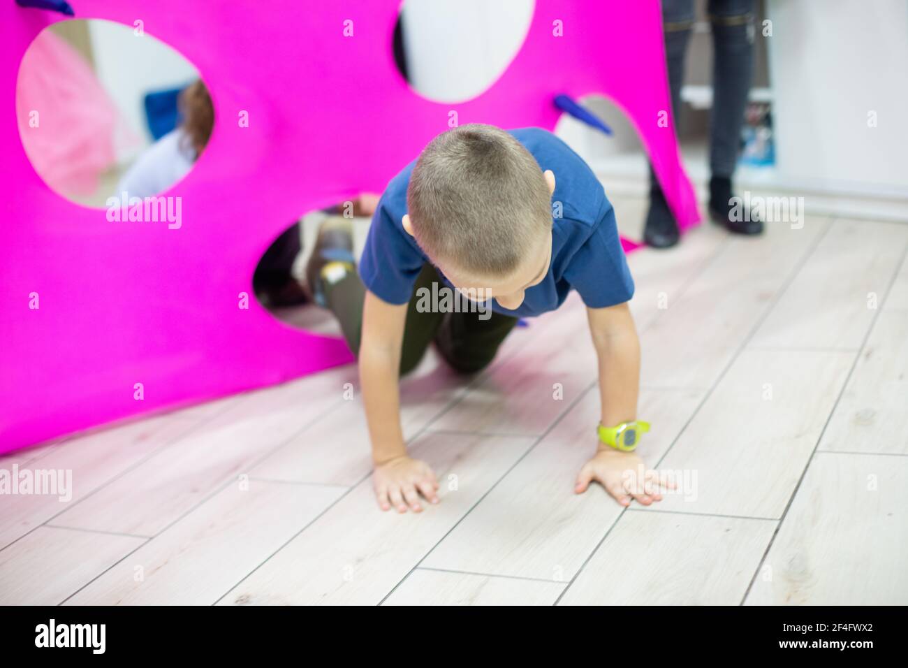 Child crawling through tunnel hi-res stock photography and images - Alamy