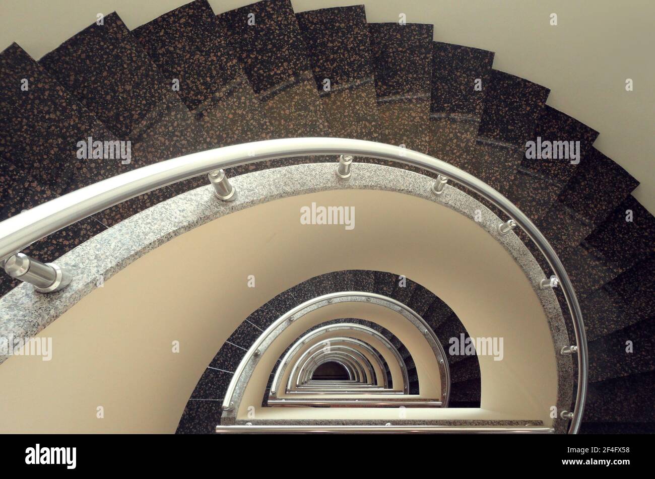 Half circle, half spiral stairs made from reflected brown stone Stock ...